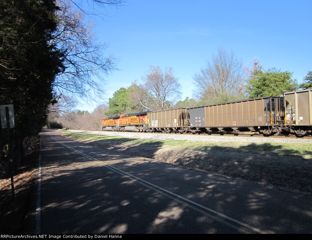 two GEVO DPU's shove hard at the rear of a loaded coal train